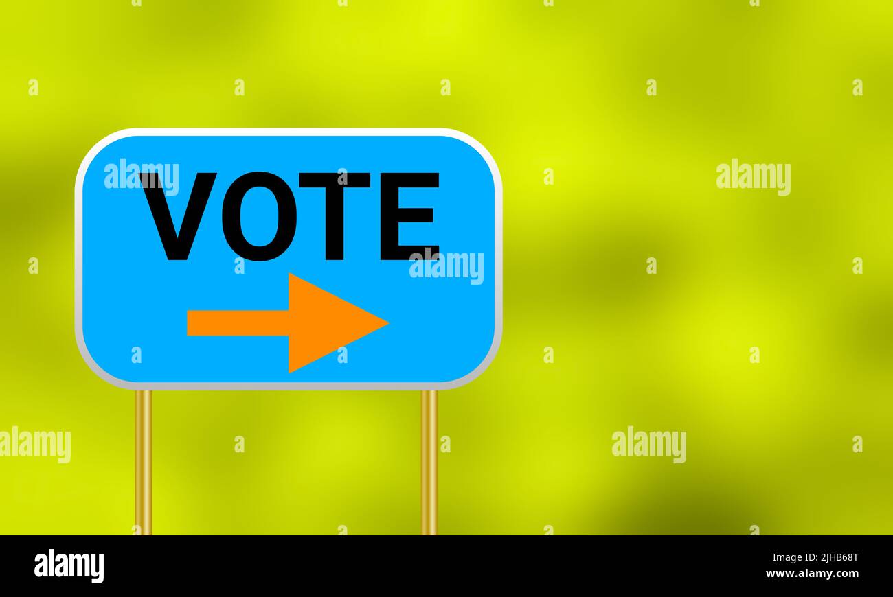 vote here sigh board isolated on green blur background Stock Photo - Alamy
