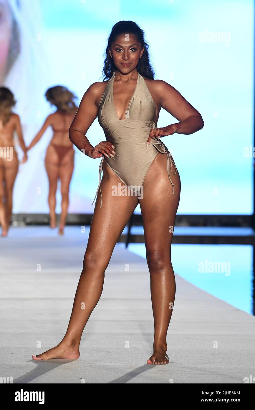 MIAMI BEACH, FL - JULY 16: Manju Bangalore walks the runway for Sports Illustrated Swimsuit ...