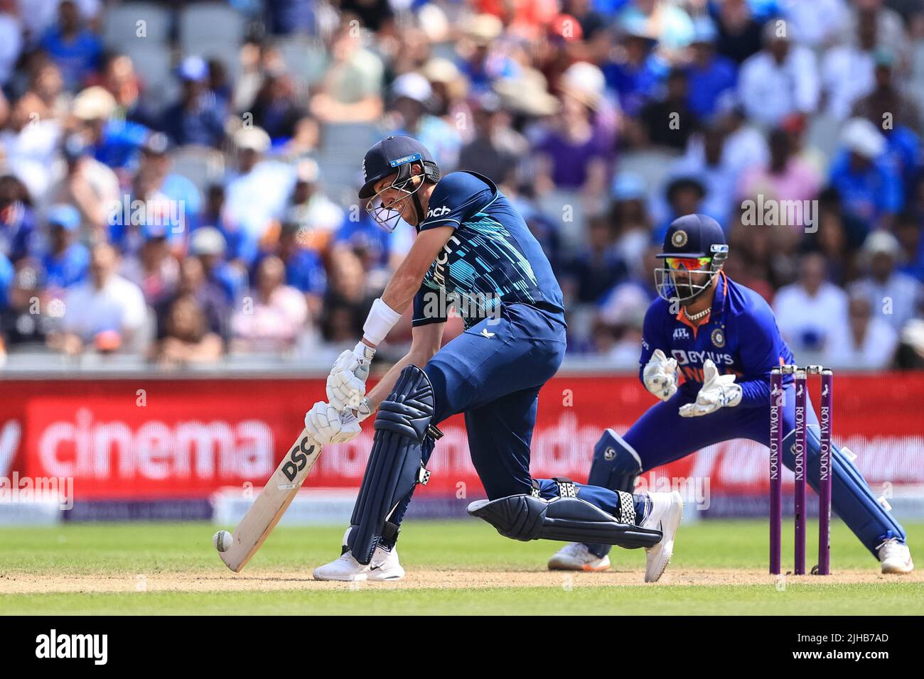 Craig Overton of England hits a six after Mohammed Siraj of India fails ...