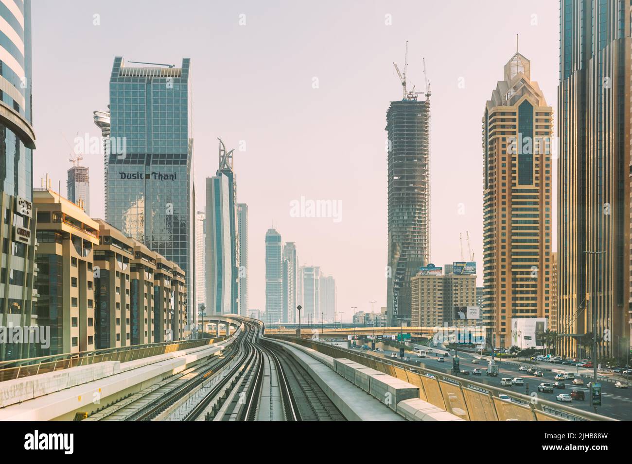 Dubai, UAE, United Arab Emirates - May 22, 2021: Metro road among glass ...