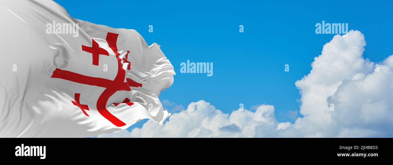 official flag of Gazis Greece at cloudy sky background on sunset ...