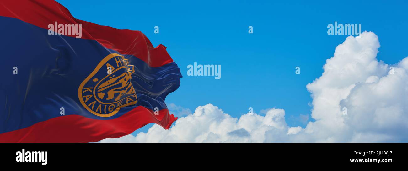 official flag of Kallithea Greece at cloudy sky background on sunset ...