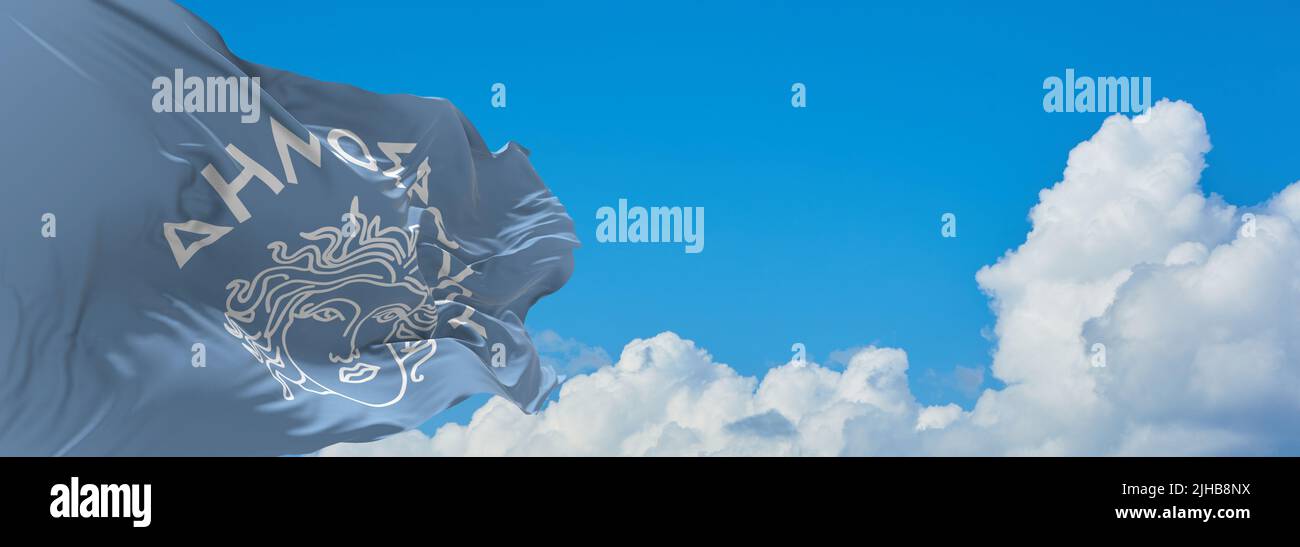 official flag of Rhodes Island Greece at cloudy sky background on ...