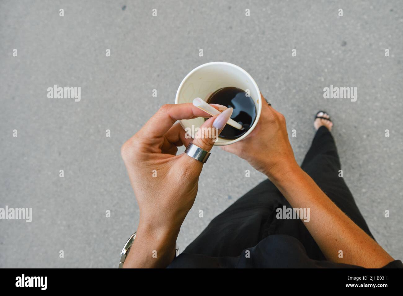 Hands holding take away cup with beverage, top view Stock Photo - Alamy