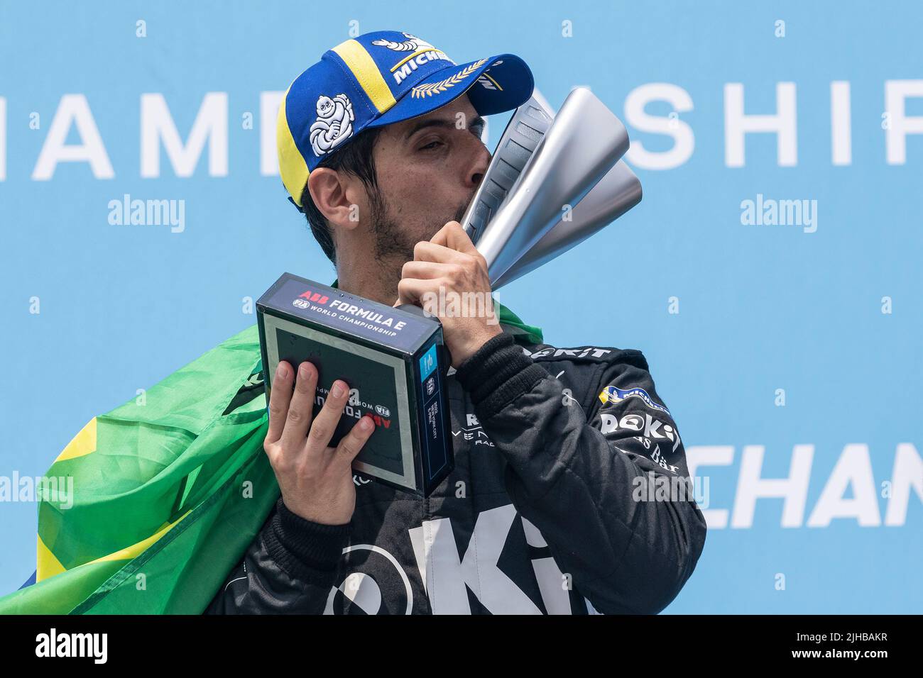 Lucas Di Grassi of RokIt team kisses trophy after winning 2nd place in ...