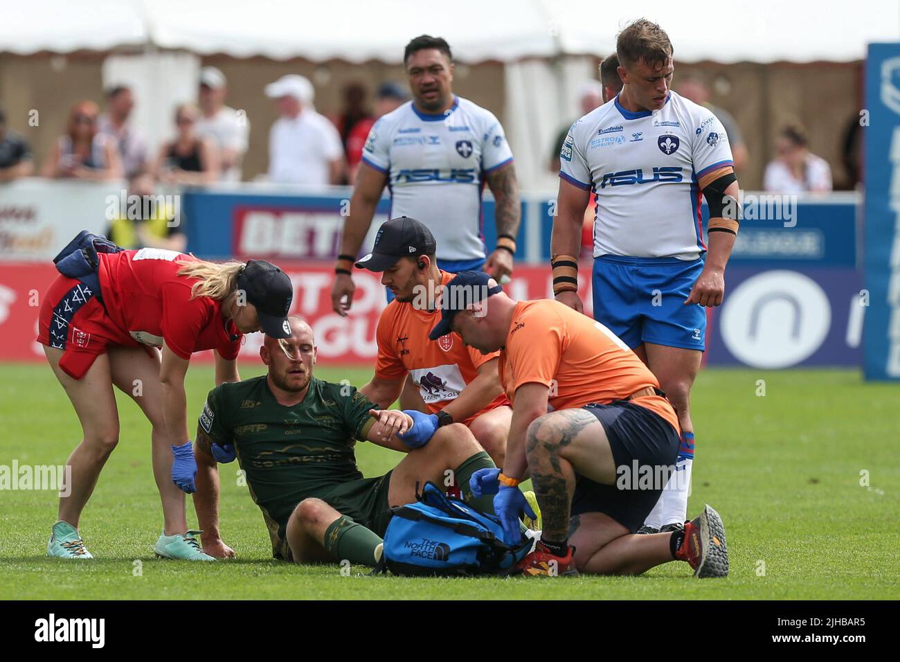 Dean Hadley #11 of Hull KR receives medical attention after being ...