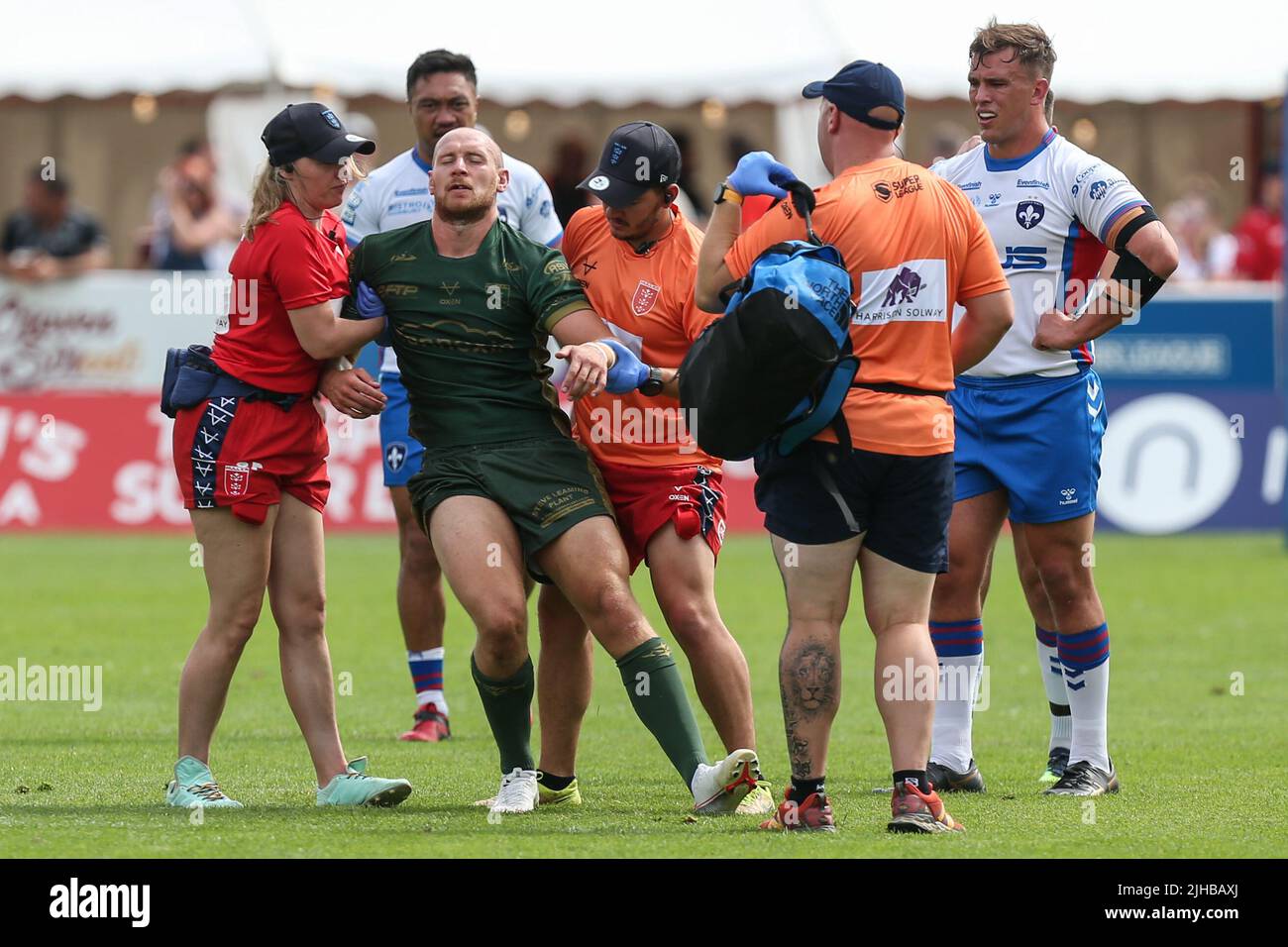 Dean Hadley #11 of Hull KR receives medical attention after being ...