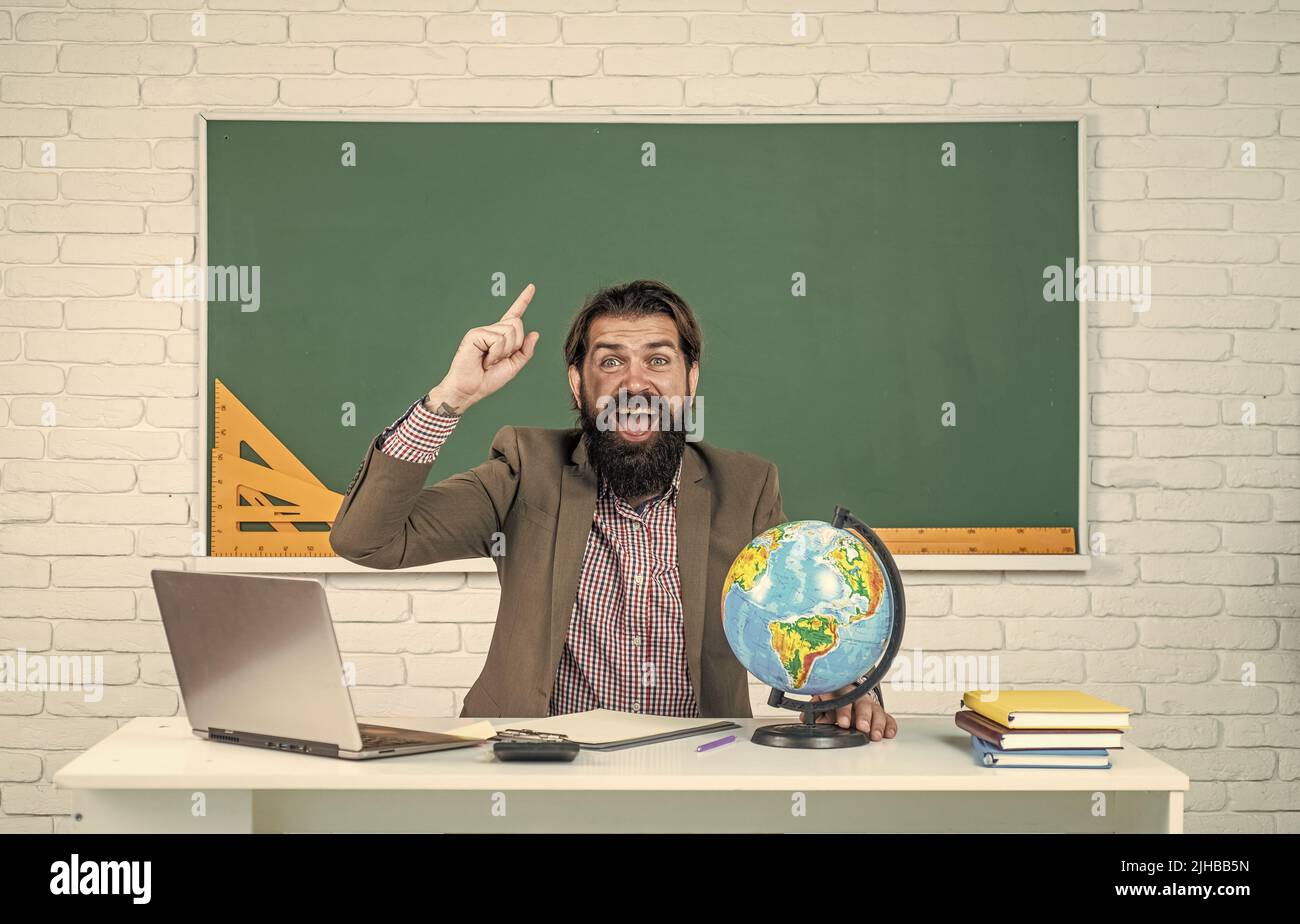 college lecturer on geography lesson. back to school. informal education. happy inspired mature ...