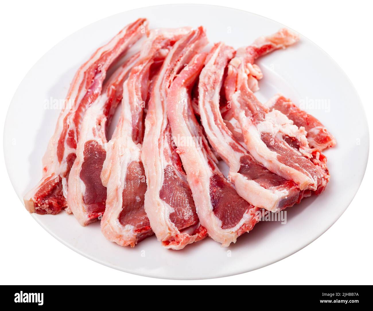 Raw lamb chops on plate Stock Photo - Alamy
