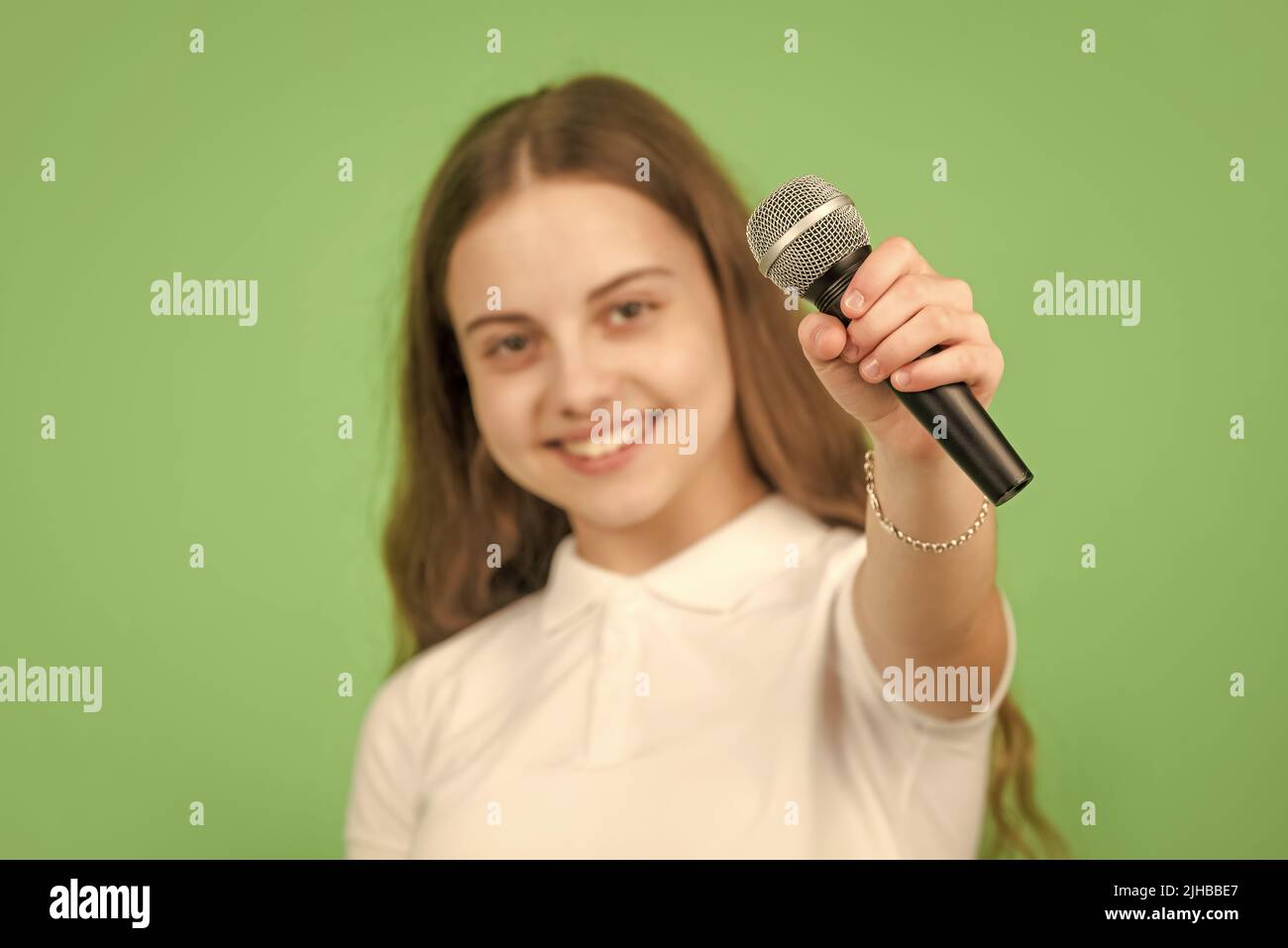 microphone in hand of happy kid, selective focus, music Stock Photo - Alamy
