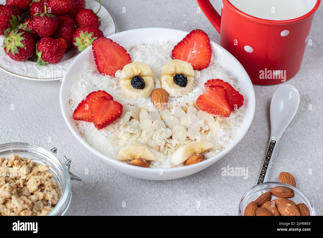 Fun breakfast for children - sweet oatmeal in the shape of an owl with ...