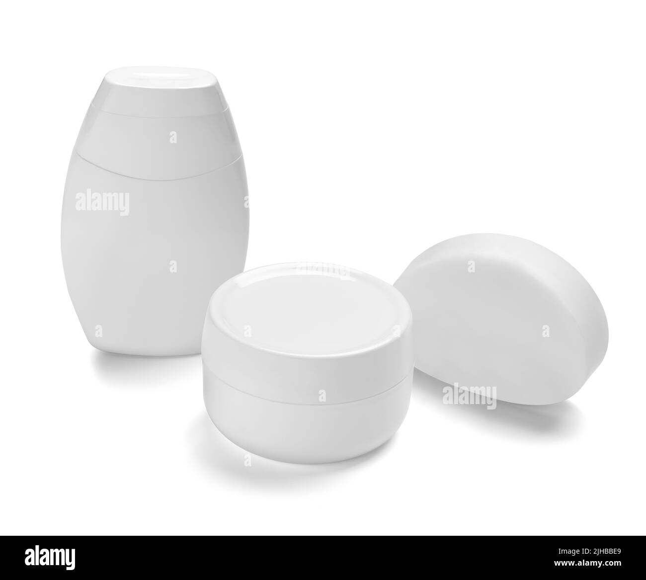 close up of a white beauty cream container and tube on white background ...