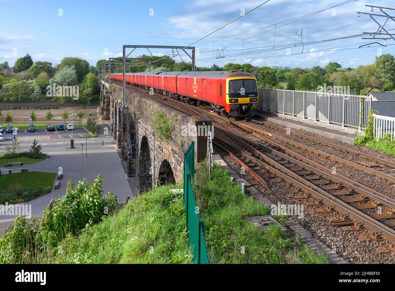 DB Cargo Royal Mail train formed of a class 325 freight unit crossing ...