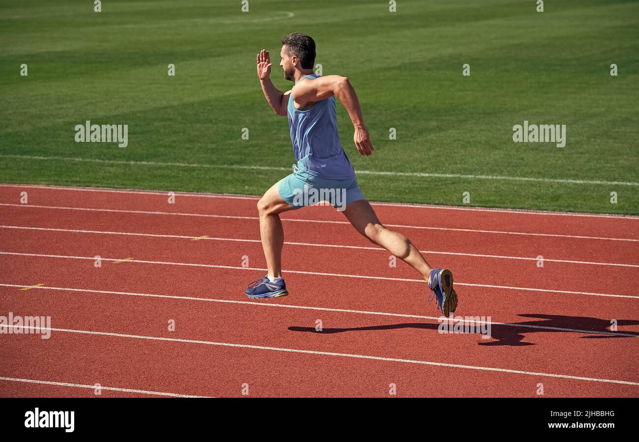 athletic muscular man runner running on stadium, energy Stock Photo - Alamy