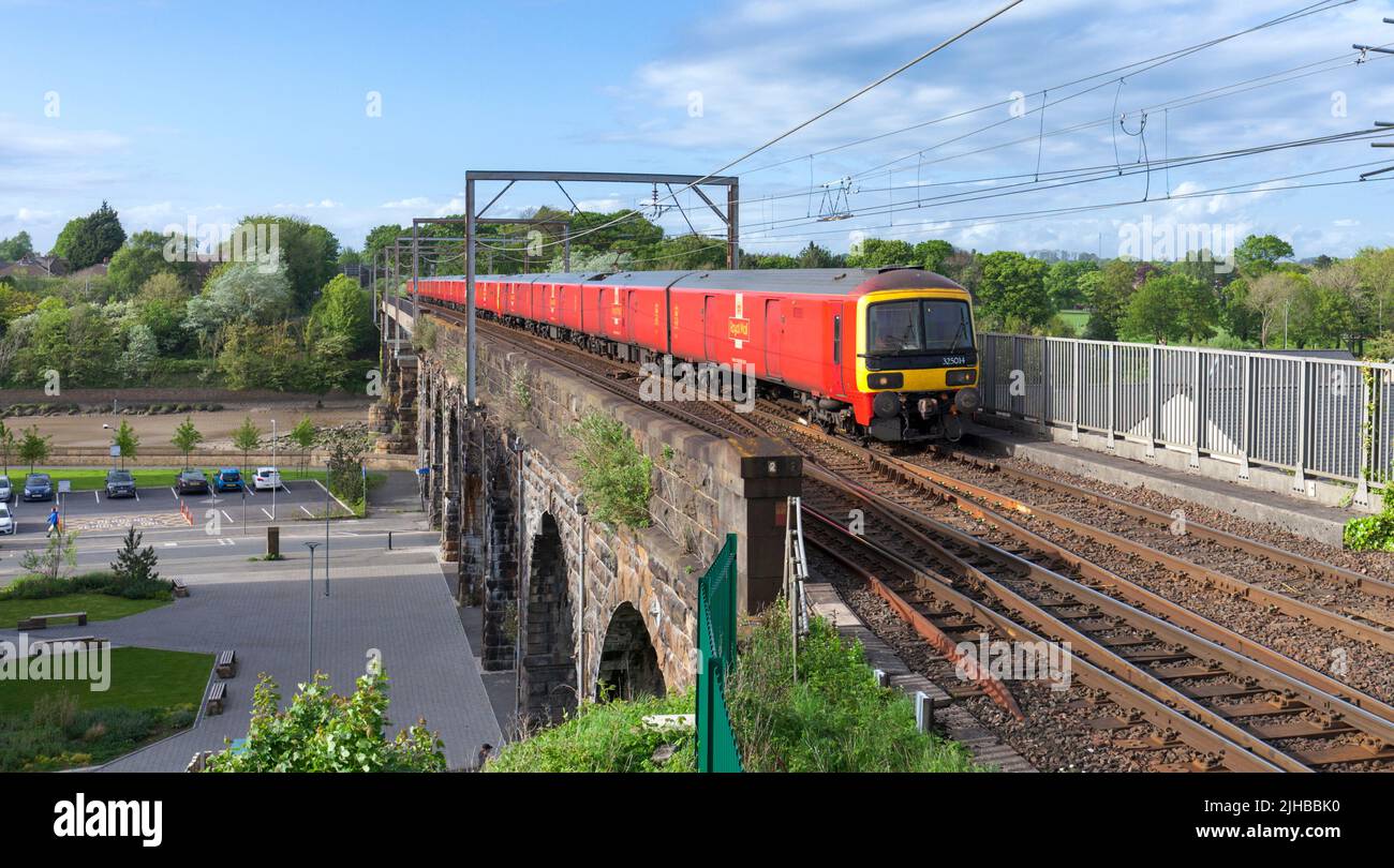 DB Cargo Royal Mail train formed of a class 325 freight unit crossing ...