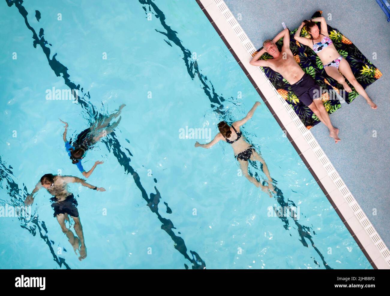 People enjoy the hot weather at Hathersage open air swimming pool at ...