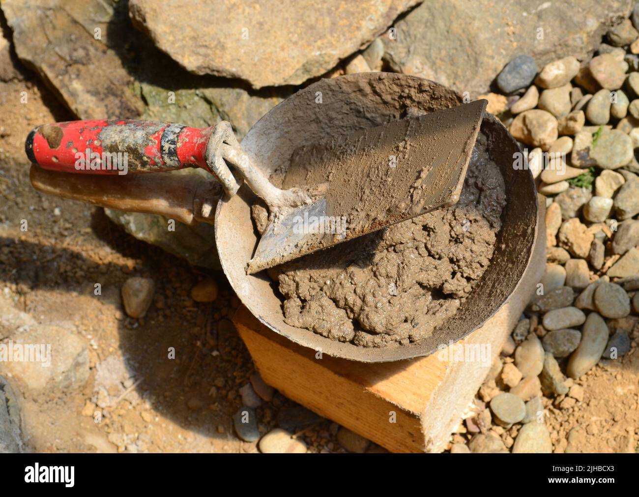Trowel and ladle, plastering tools Stock Photo - Alamy