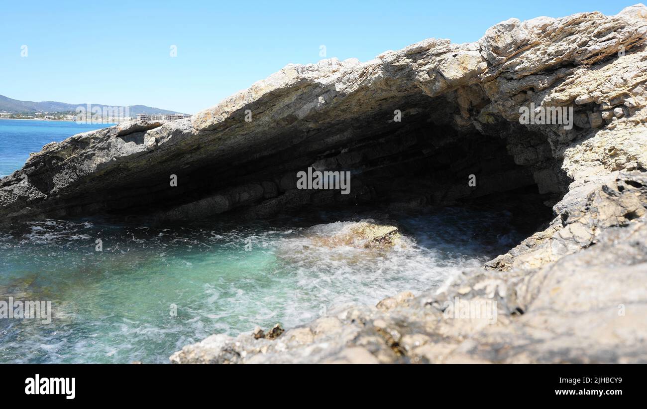 A scenic view of a small lagoon near the ocean in sunny weather in blue ...