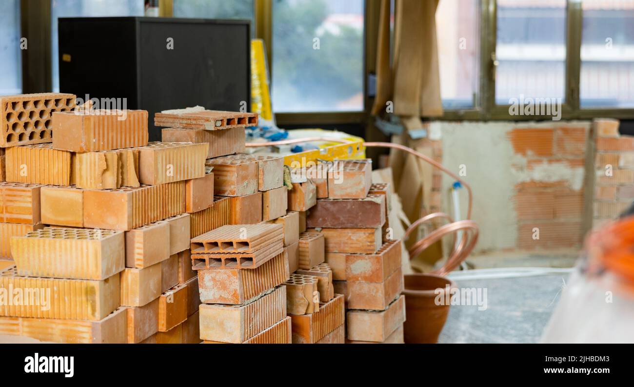 Bricks and materials for renovation in house Stock Photo - Alamy