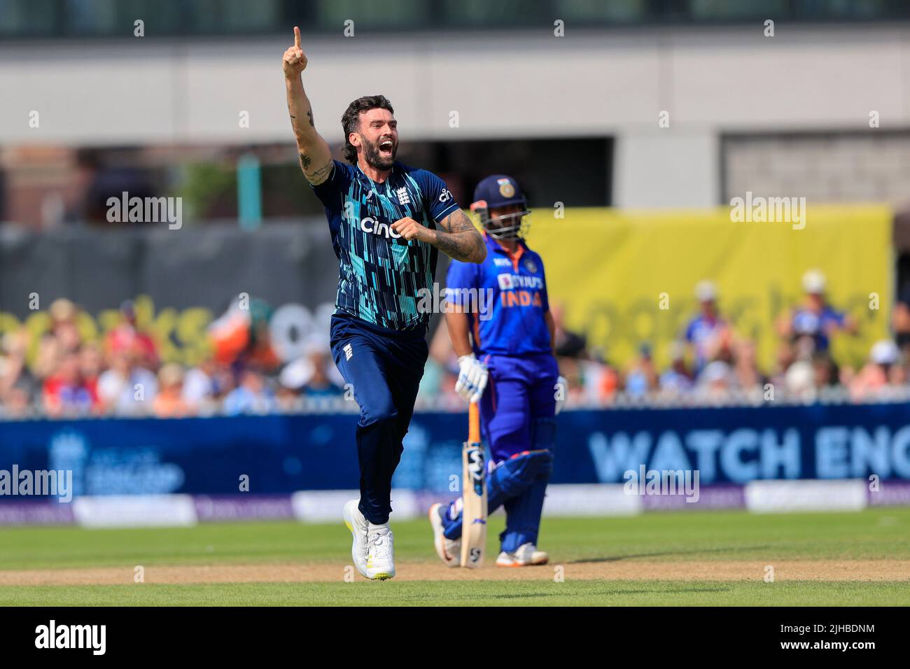 Reece Topley of England celebrates taking the wicket of Virat Kohli of ...