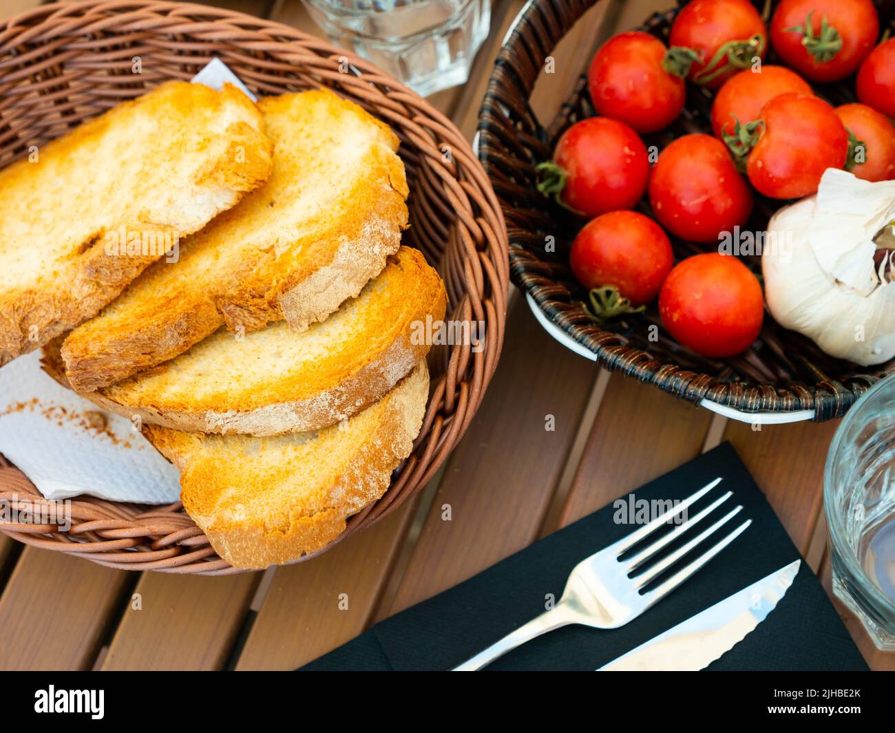 Traditional Catalan dish, pan con tomate, served on table Stock Photo ...