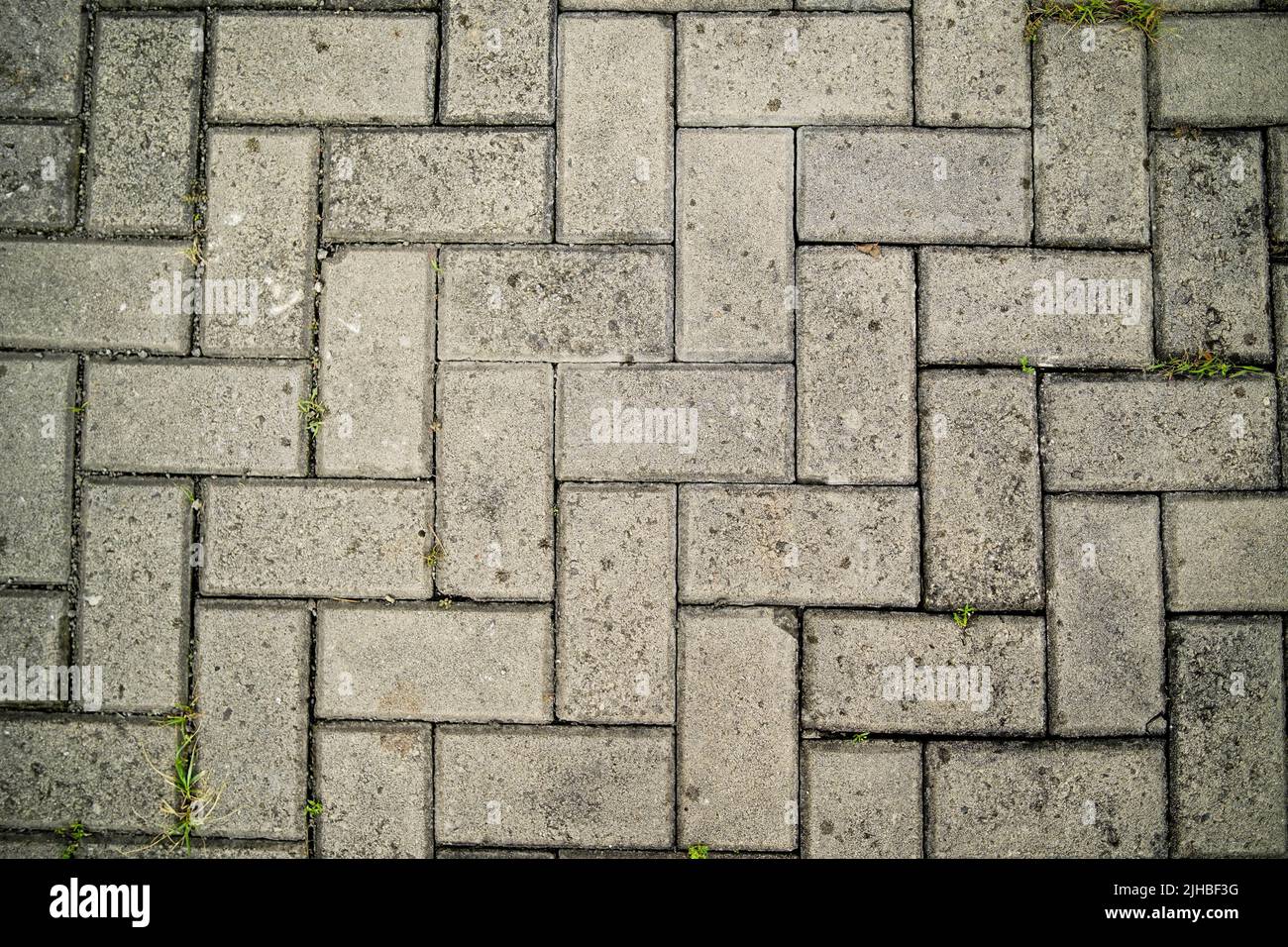 The texture of the gray conblock floor is neatly arranged, seen from ...