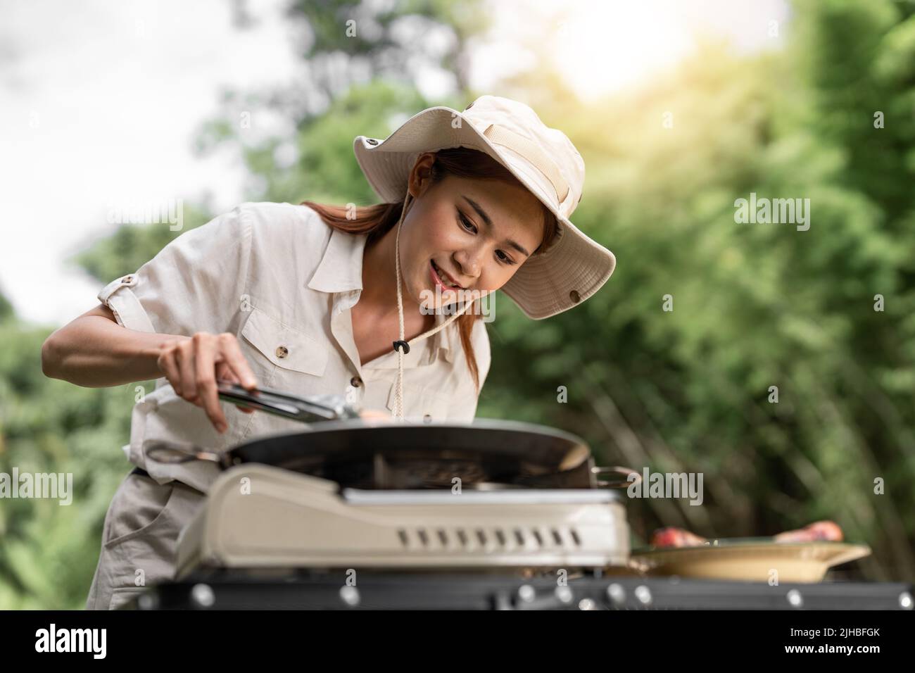 Girl barbecuing meat grill food roast hi-res stock photography and ...