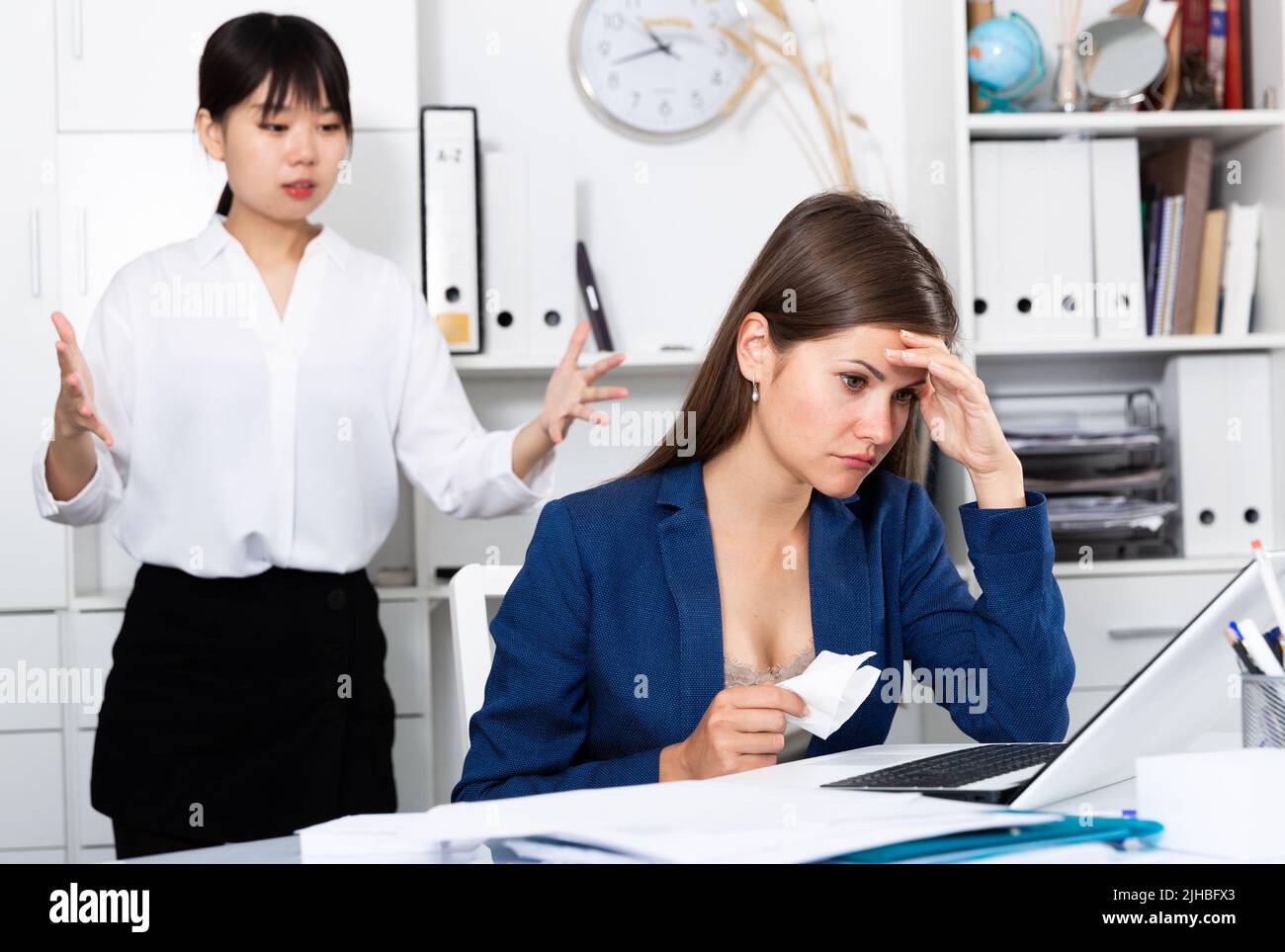 Angry boss screaming to young female manager during working Stock Photo ...
