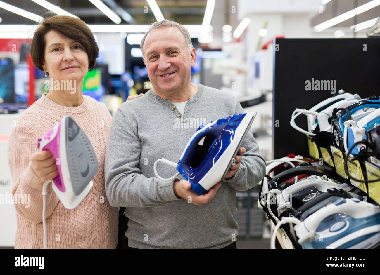 Woman irons clothes hi-res stock photography and images - Alamy