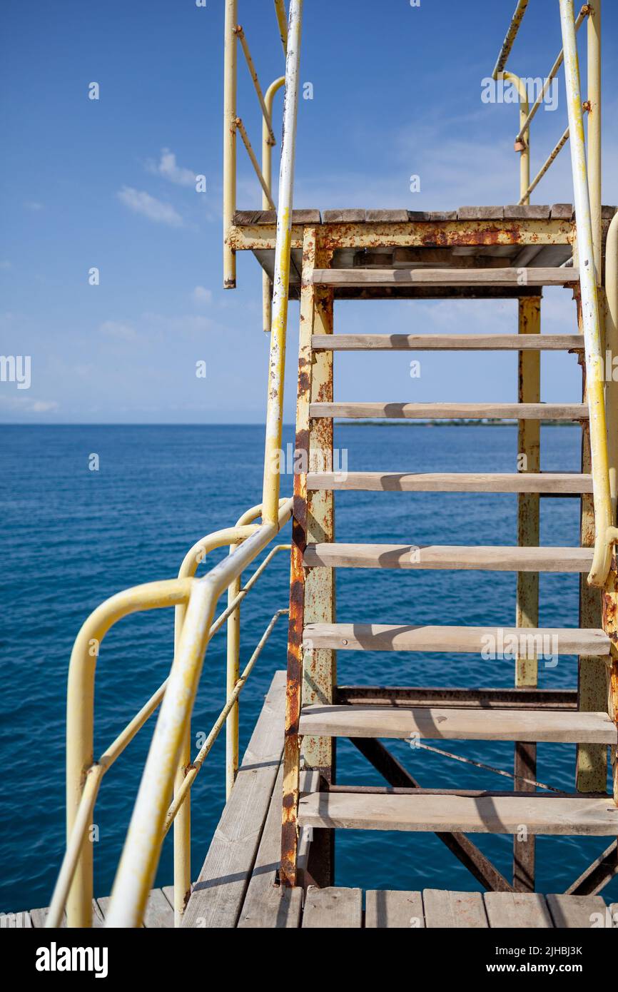 Swimming area or pier on the sea. A large pier with a roof, wooden ...