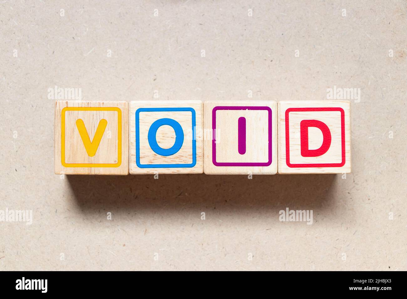 Color letter block in word void on wood background Stock Photo - Alamy