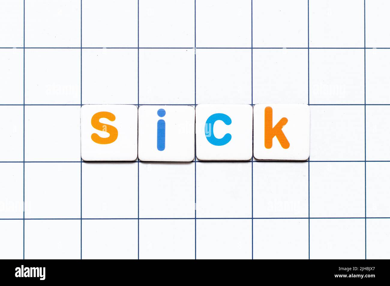 Colorful tile letter in word sick on white grid background Stock Photo ...