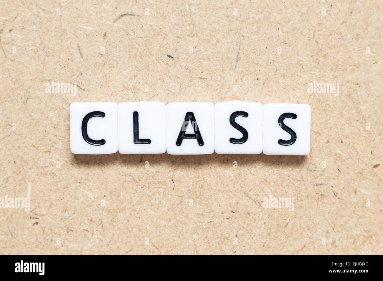 White tile alphabet letter with word class on wood background Stock ...
