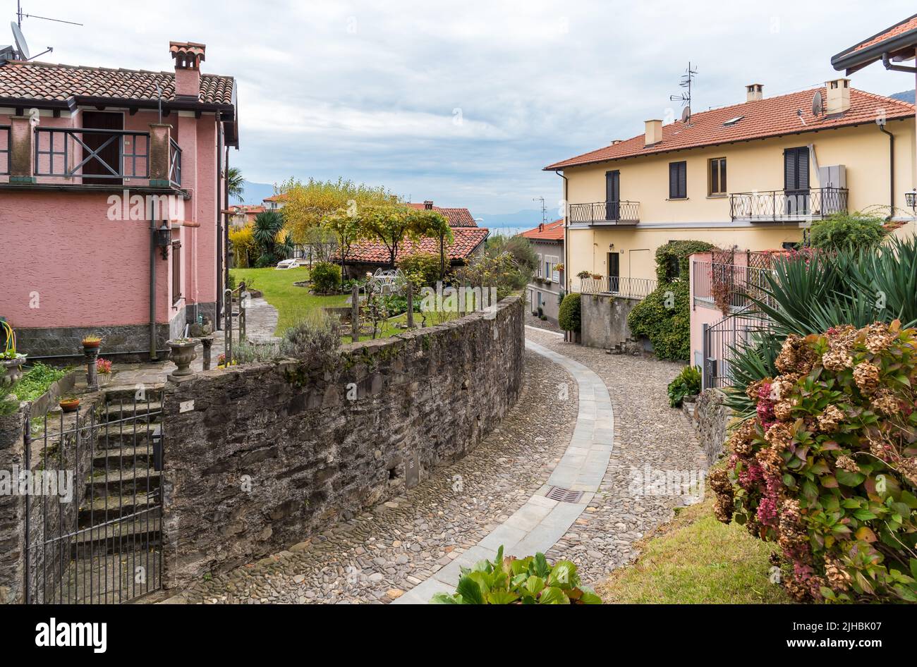 Cobblestone streets in the historic center of Maccagno Inferiore, is ...
