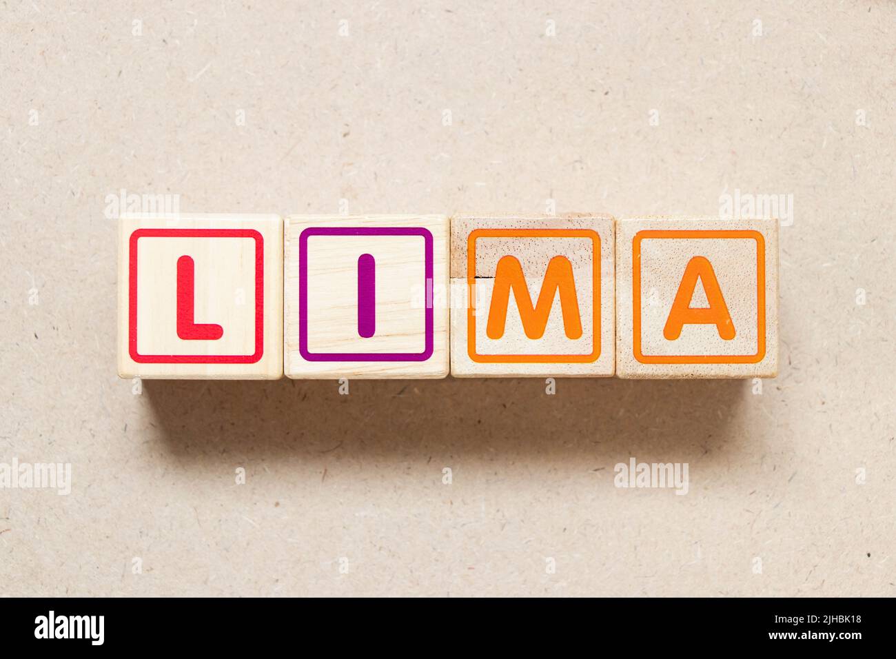 Color letter block in word lima on wood background Stock Photo - Alamy