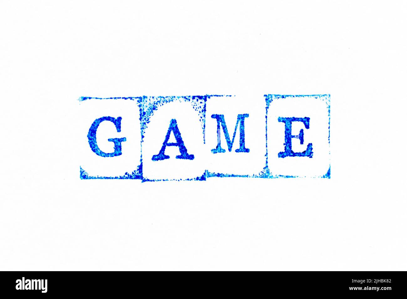 Blue color ink rubber stamp in word game on white paper background ...