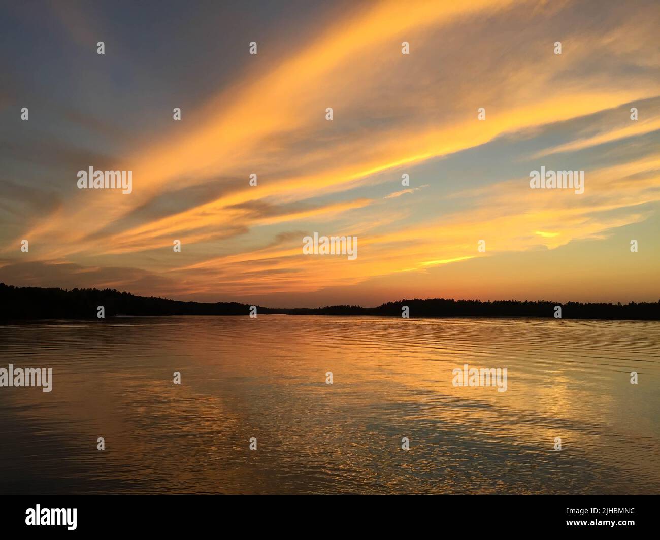 Spectacular sunset on Burntside Lake in northern Minnesota near ...
