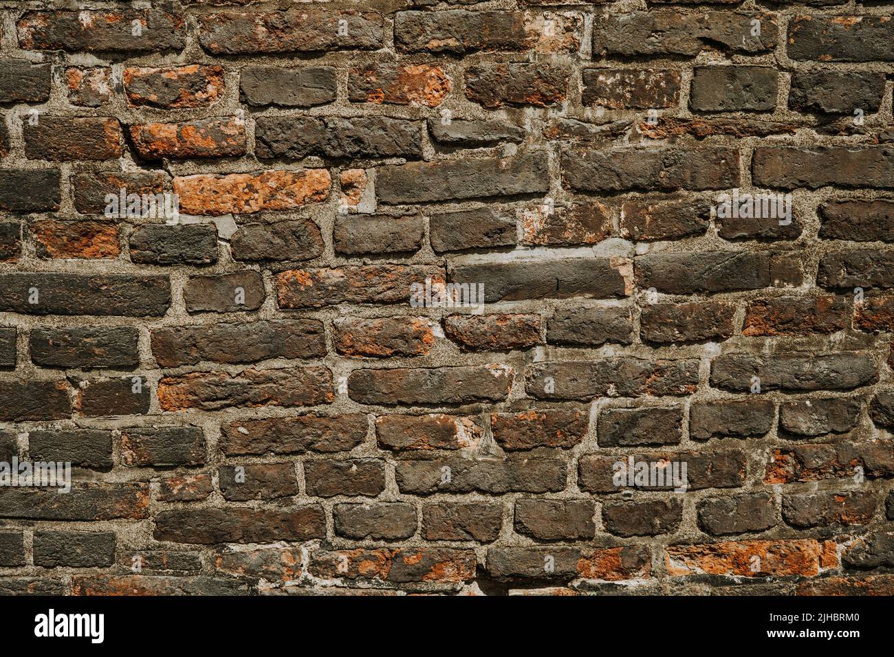 Ancient bricks wall, paving stones in medieval european city. Texture ...