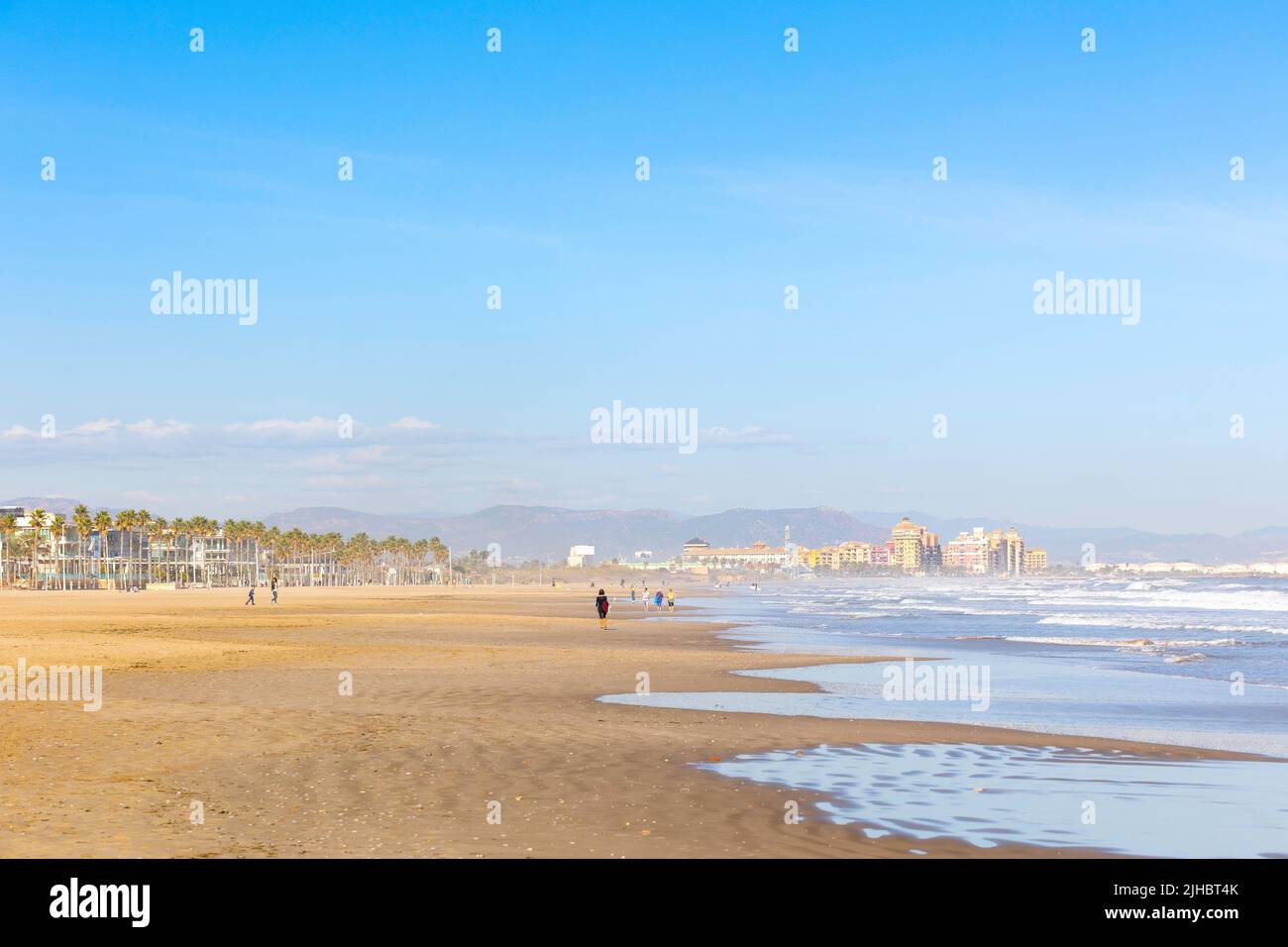 Summer vibes on the sunny autumn beach of Malvarrosa in Valencia, Spain ...