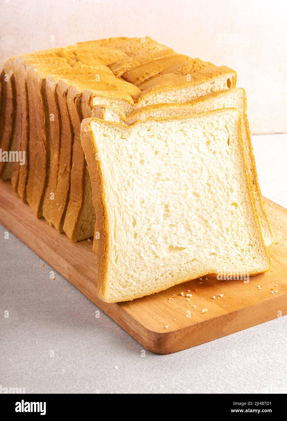 Stack of slice bread isolated on bright background. Close up Stock ...