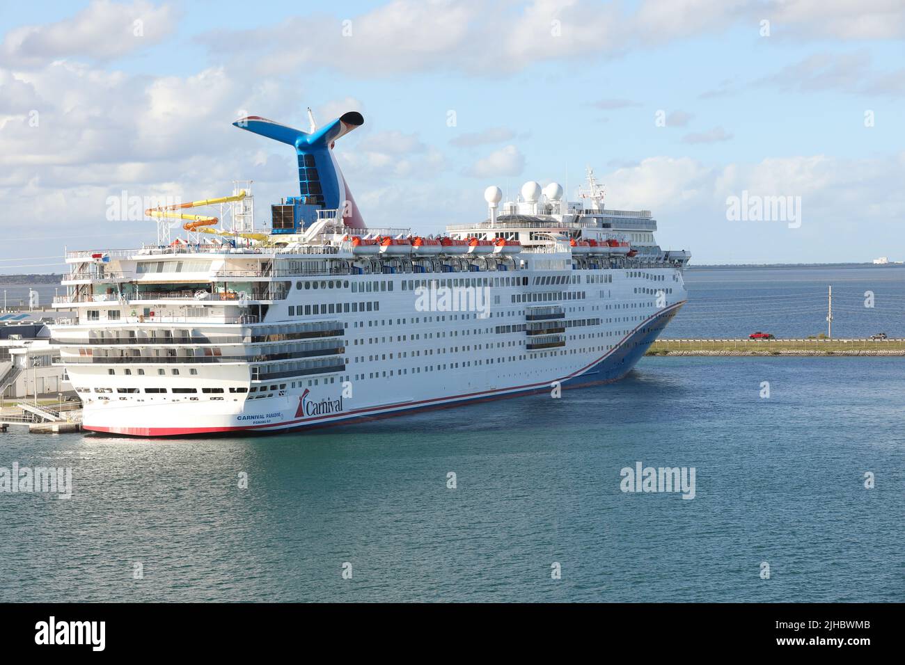Carnival "paradise" cruise ship tendered next to the tropical island ...