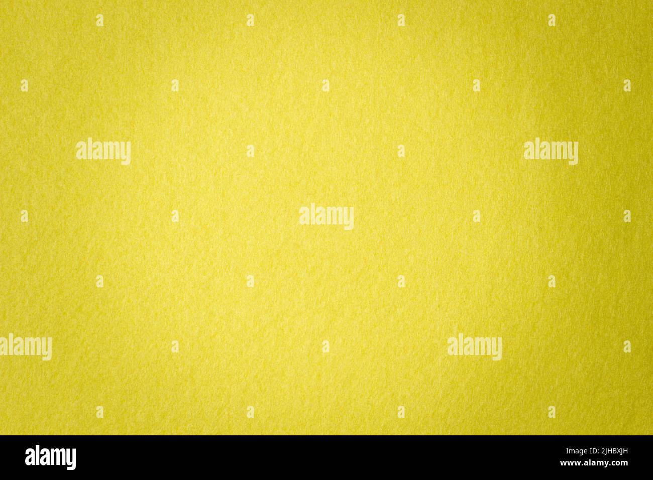 Yellow color felt textile fabric texture background Stock Photo - Alamy