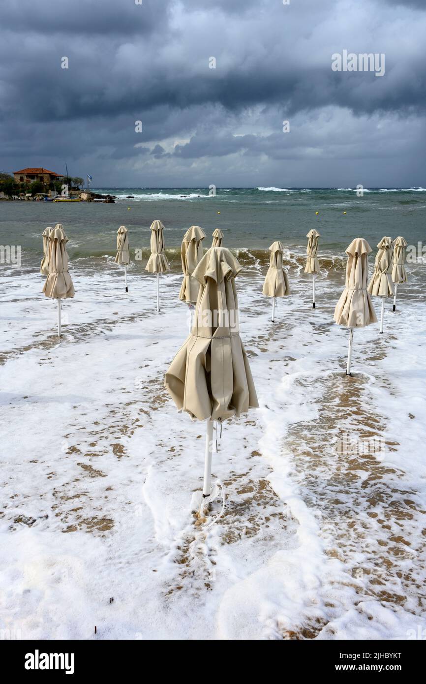A late season storm causes waves to inundate the beach and beach ...