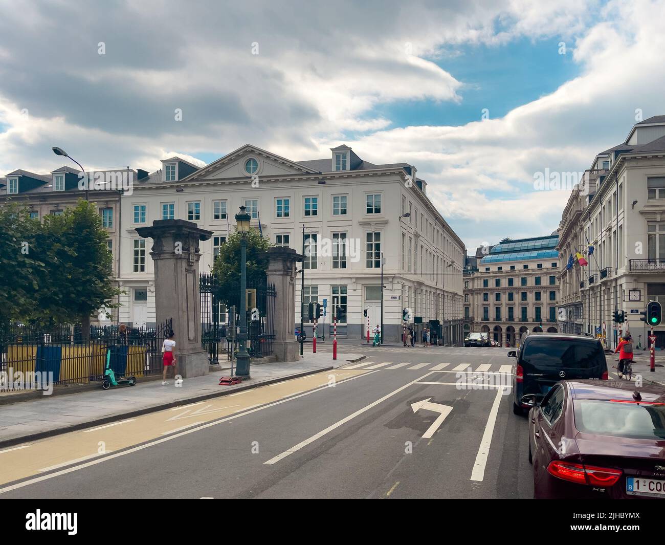 Few cars drive while the traffic light is green Stock Photo - Alamy