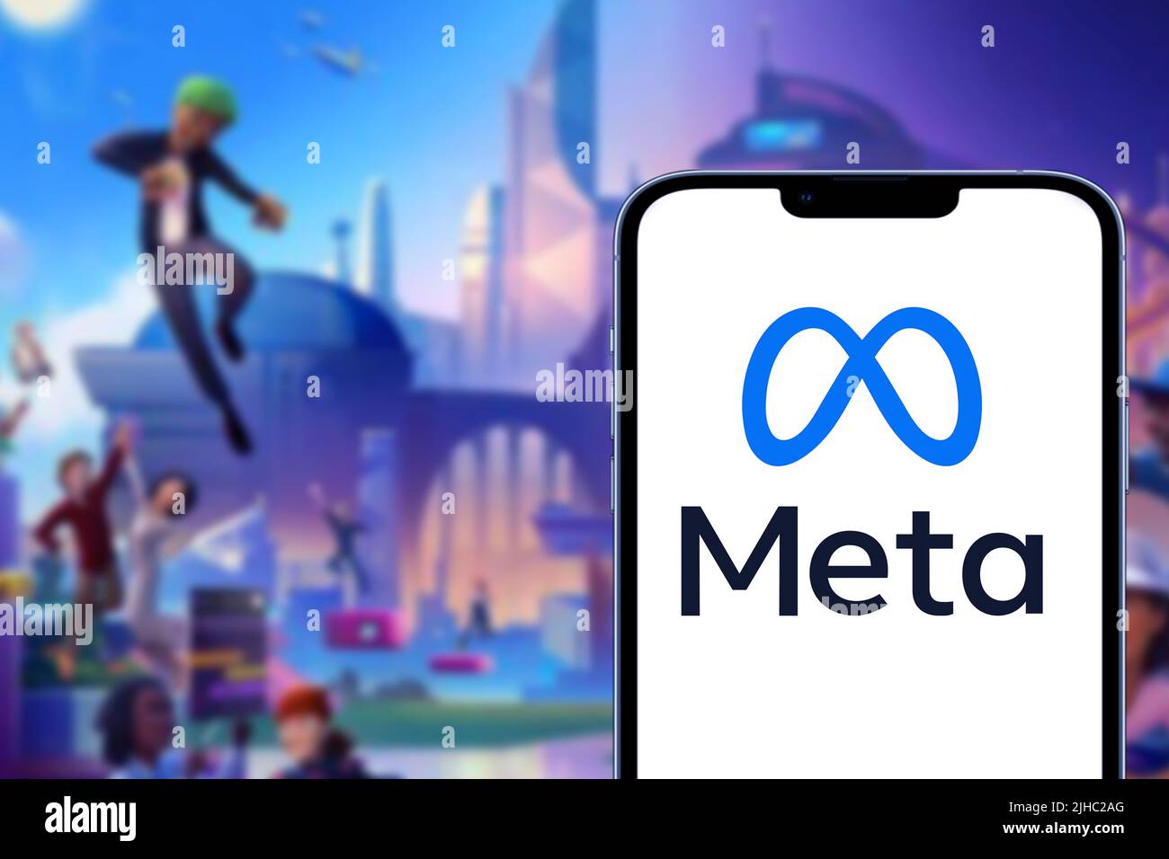 Smartphone with Meta or MetaVerse logo lies on wooden table with two ...