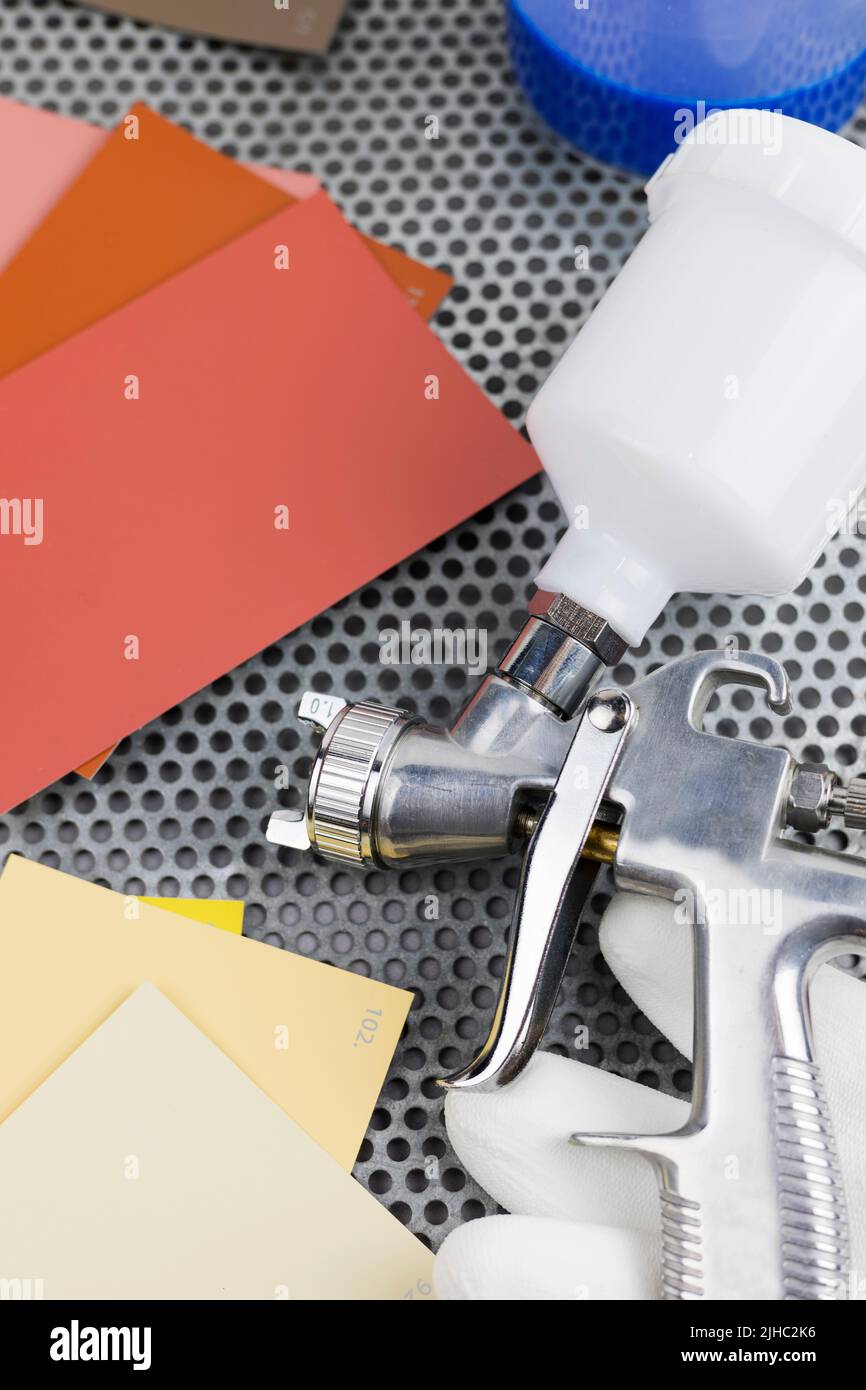 paint spray gun at work at the workplace in the workshop Stock Photo ...