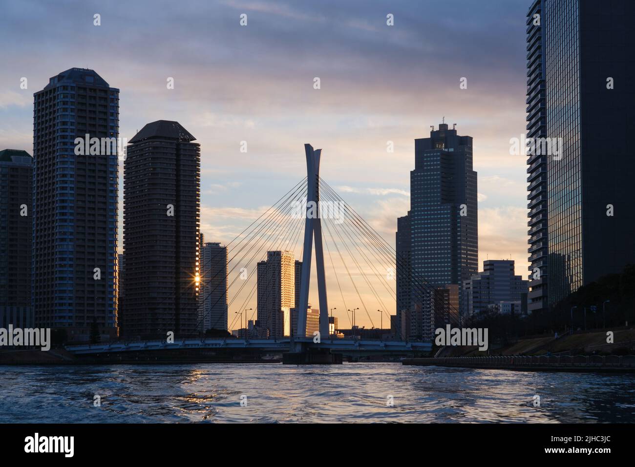 Beautiful view of the skyscrapers in Tokyo at sunset from the river ...