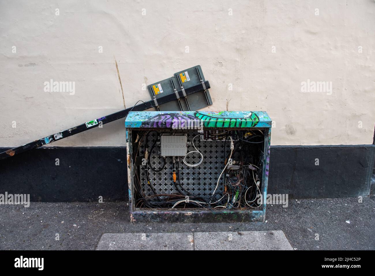 Collapsed sign and exposed electrical box Stock Photo - Alamy