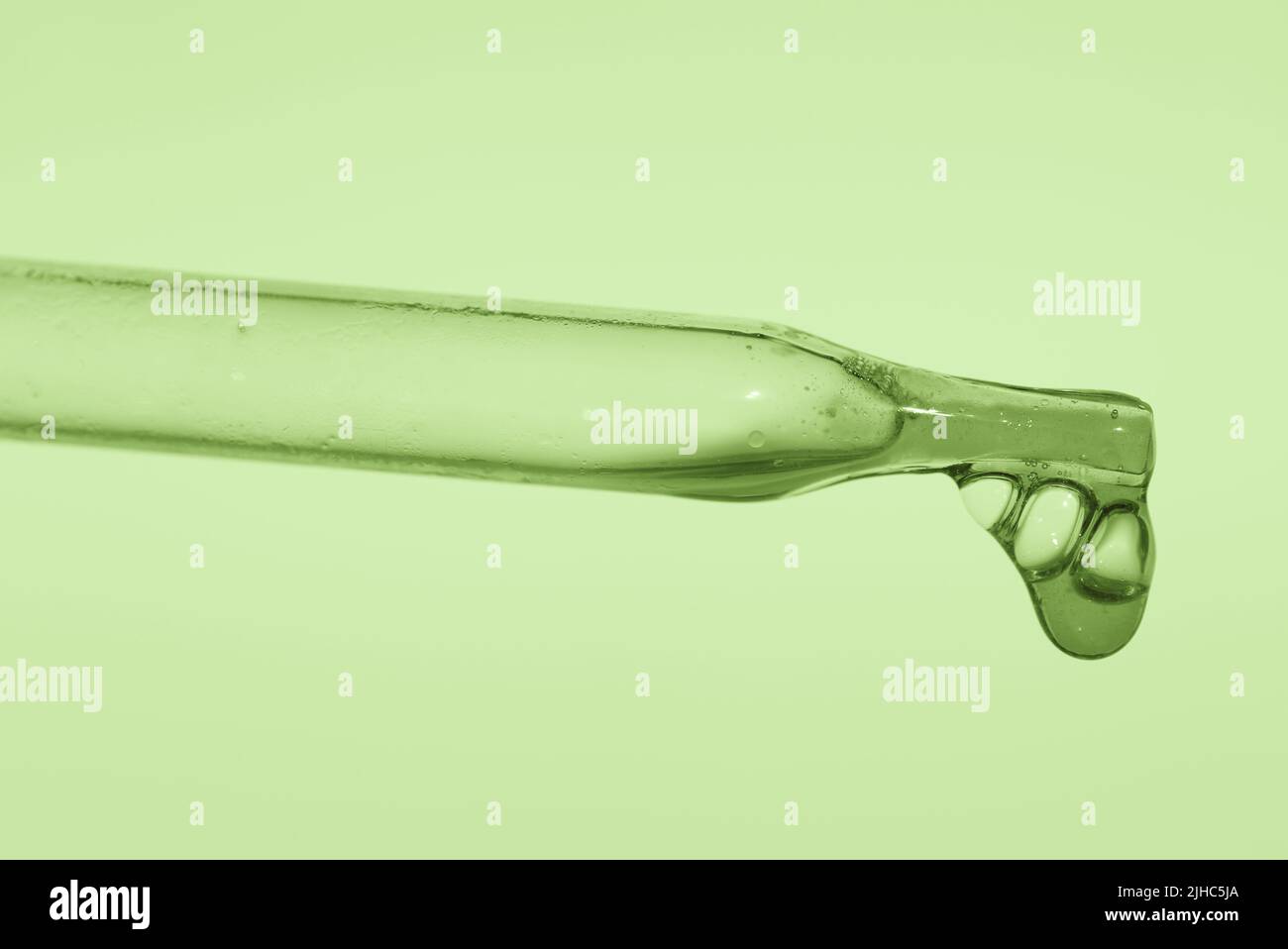 Green acrylic paint in a pipette.The fluid art of ebru. Mixing of ...