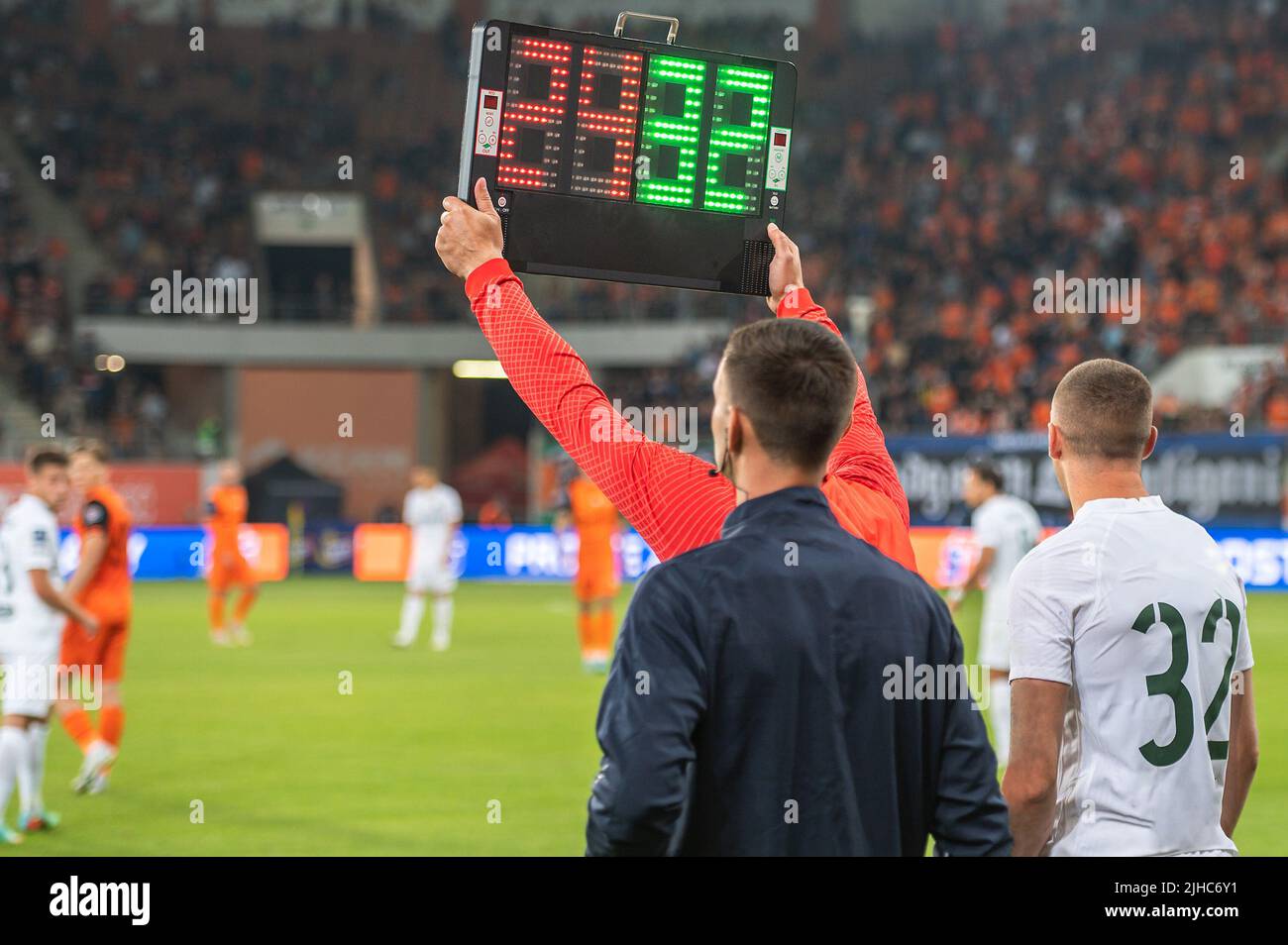 Man shows players substitution during soccer match Stock Photo - Alamy